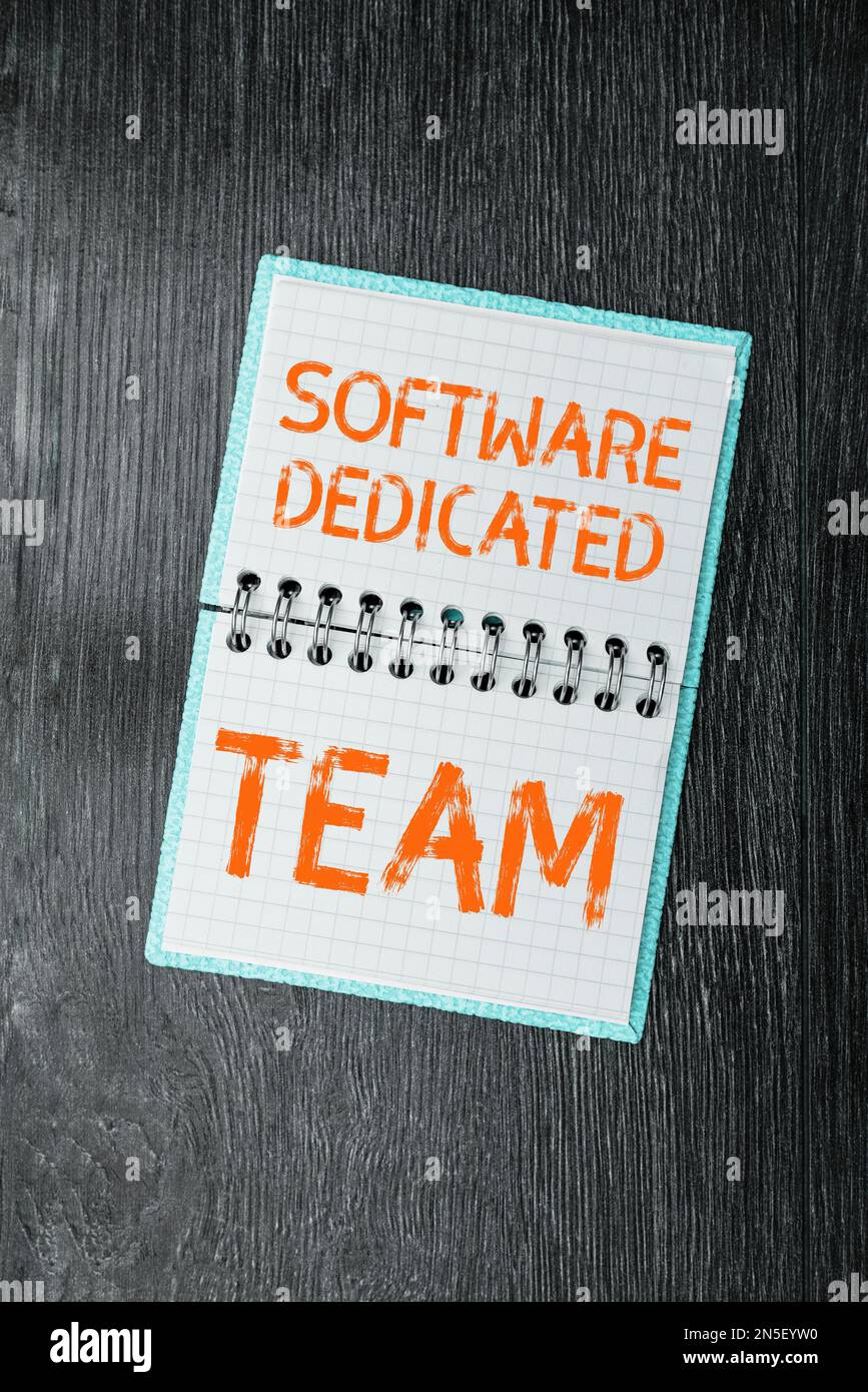Hand writing sign Software Dedicated Team. Business showcase people ...