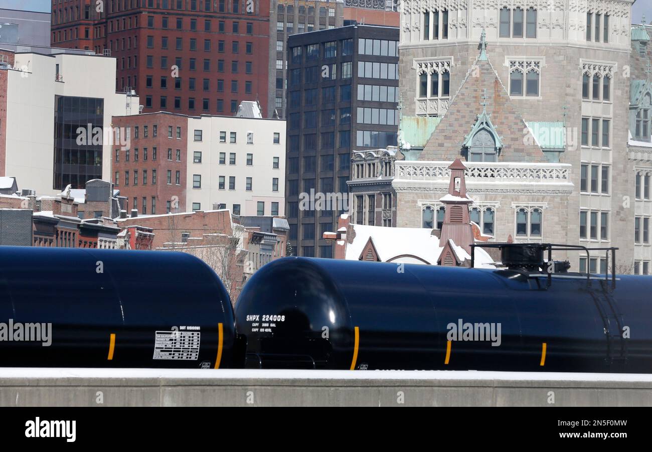 Railroad oil tanker cars are parked along Interstate 787 in downtown ...