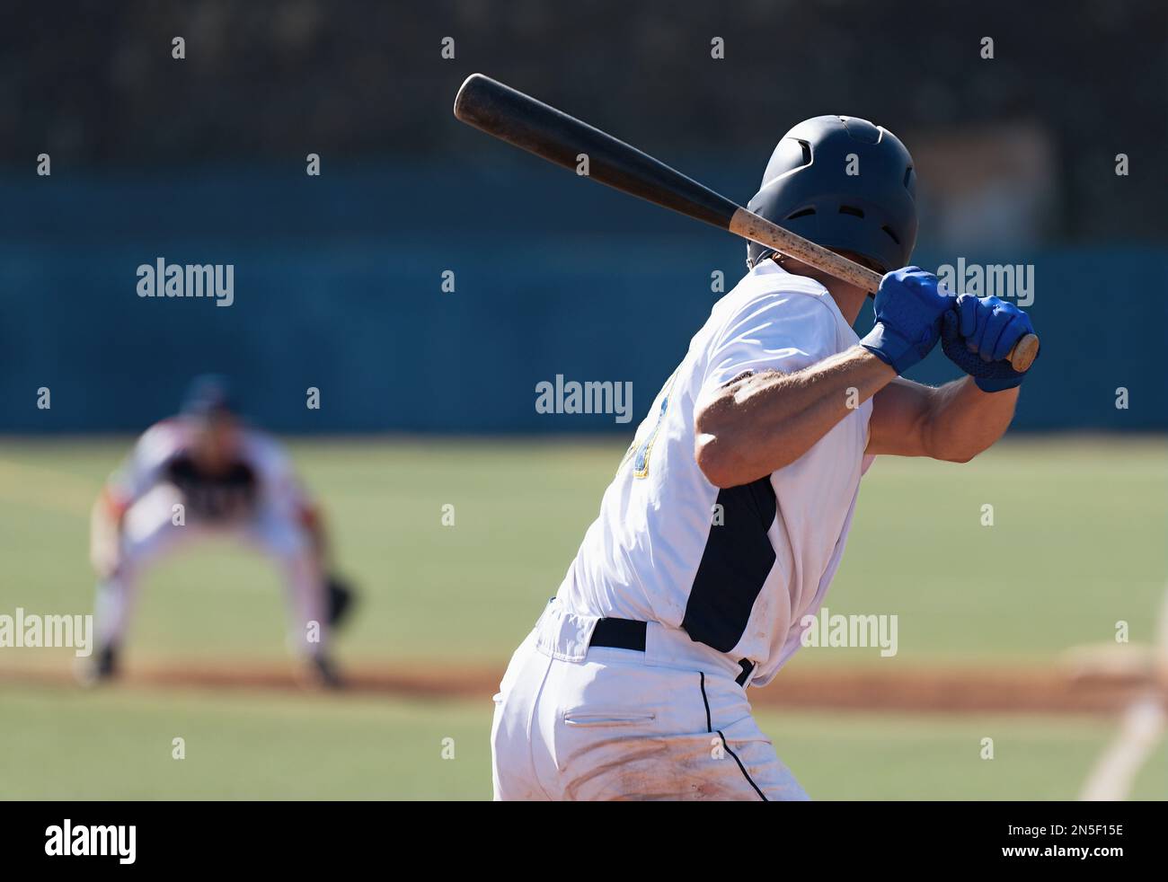 Baseball players in action on the stadium, baseball batter waiting to ...