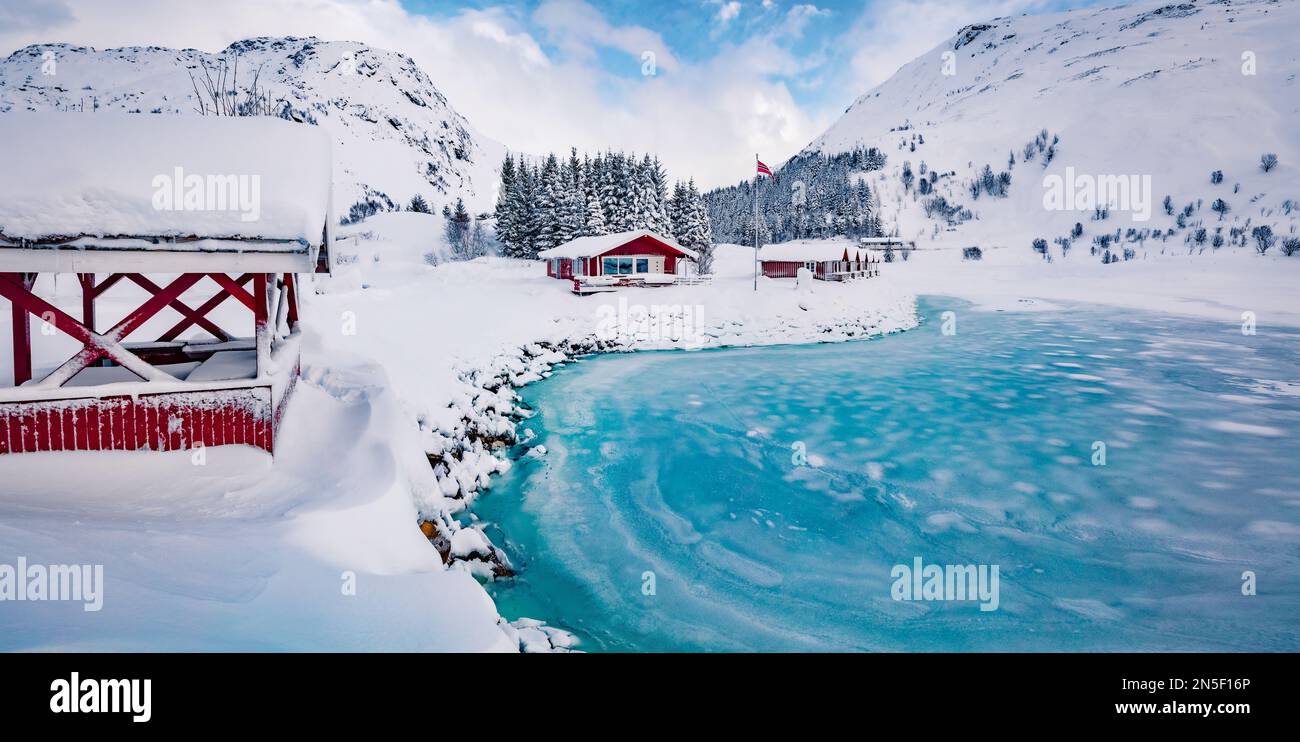 Life over polar circle. Traditional Norwegian red wooden houses on the ...