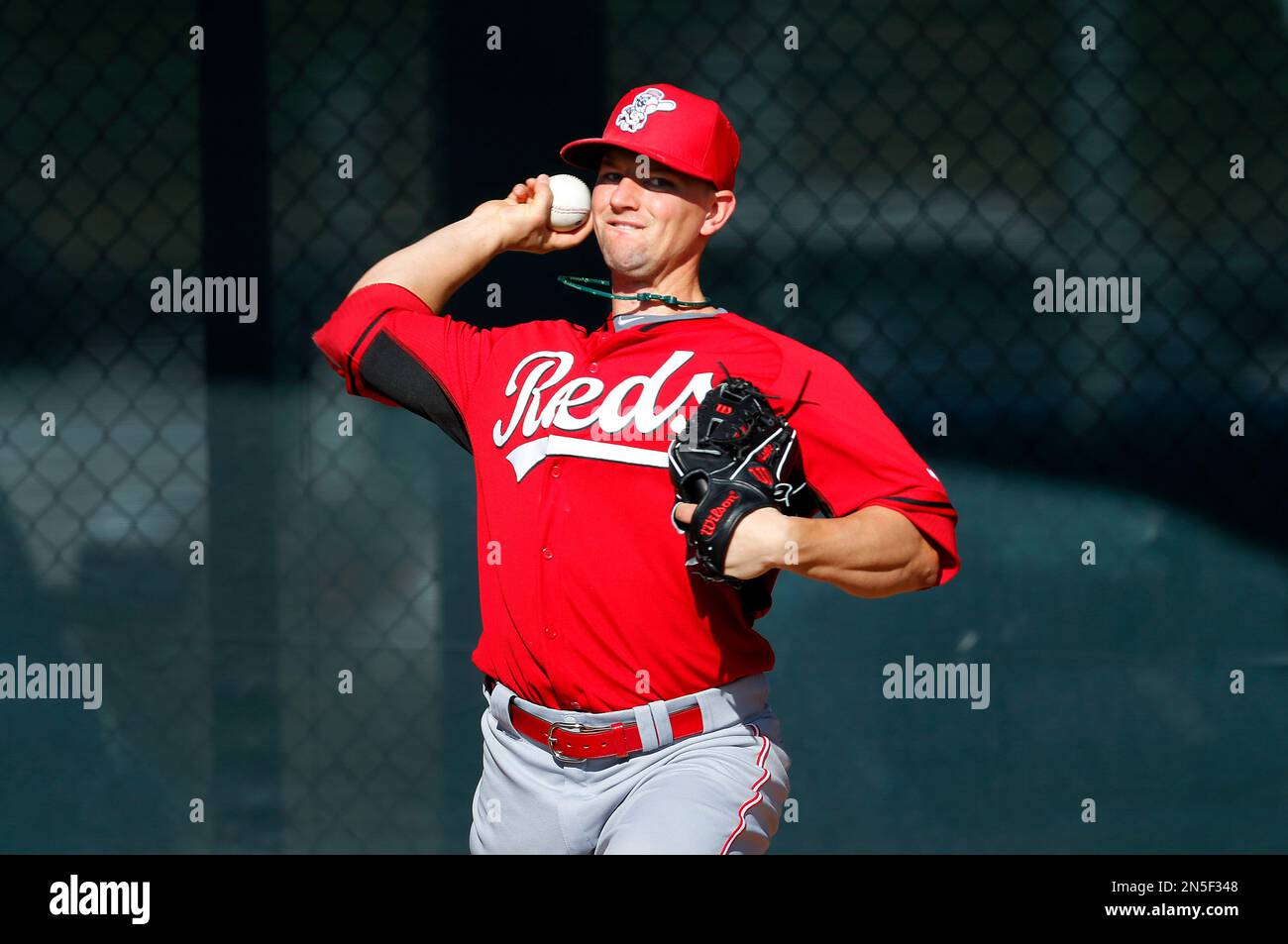 Cincinnati Reds pitcher Mike Leake throws during spring training ...