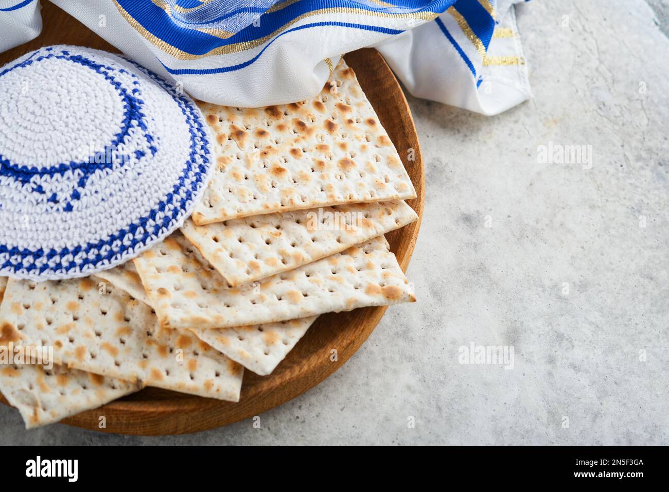 Passover celebration concept. Matzah, red kosher and walnut ...