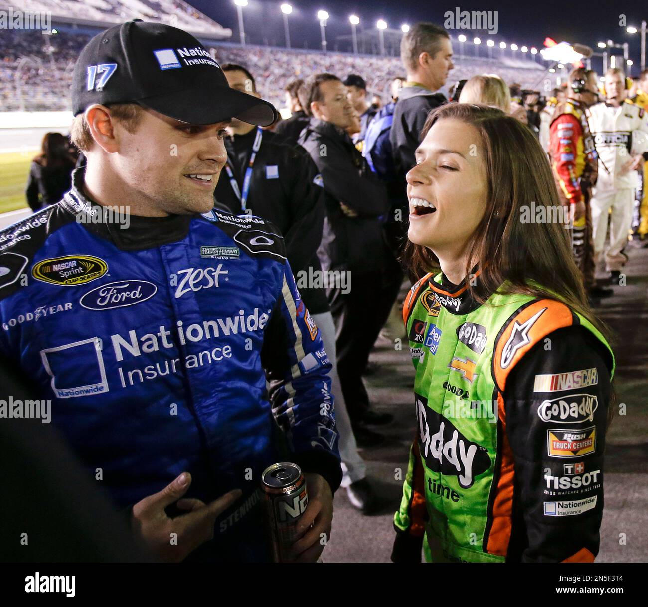 Drivers Ricky Stenhouse Jr., left, and Danica Patrick get together on ...