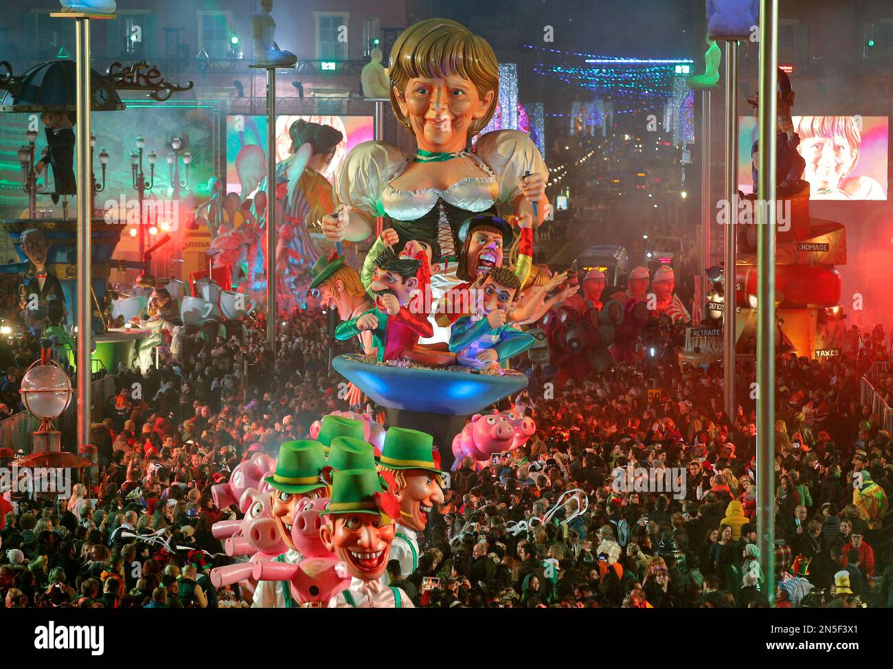 A float depicting German Chancellor Angela Merkel parades during the ...