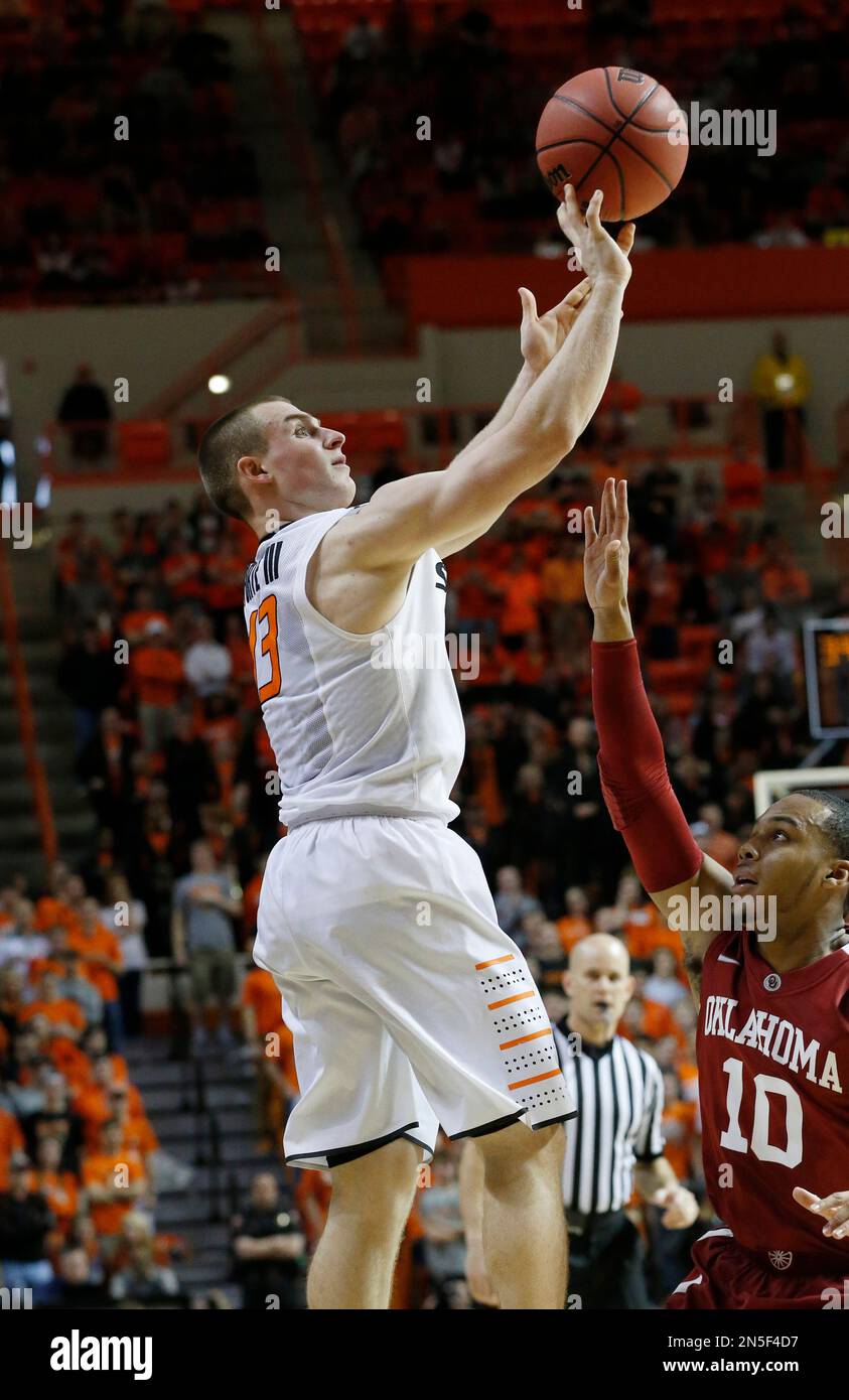 Oklahoma State guard Phil Forte (13) shoots over Oklahoma guard Jordan ...