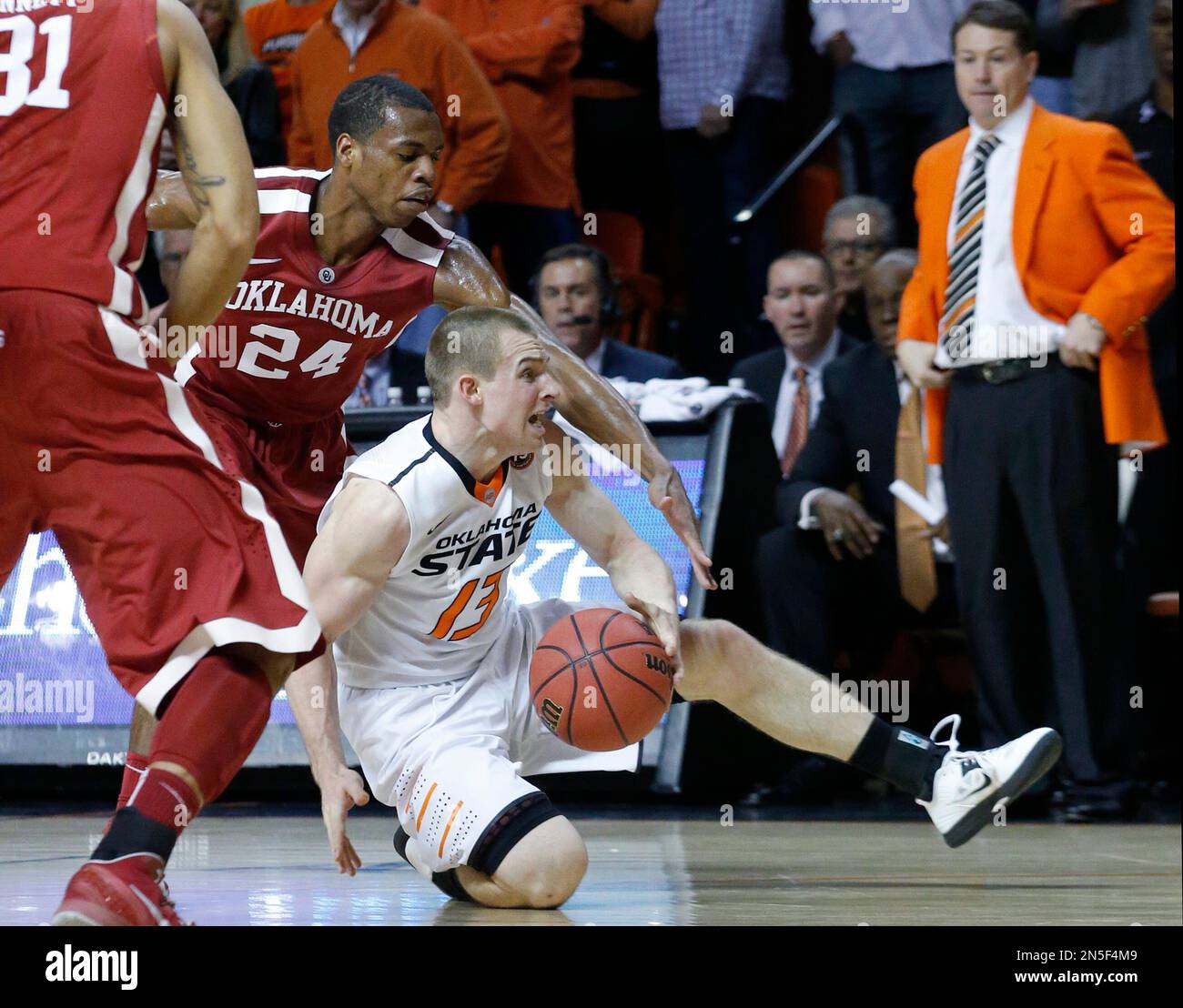 Oklahoma State guard Phil Forte (13) keeps the ball from Oklahoma guard ...