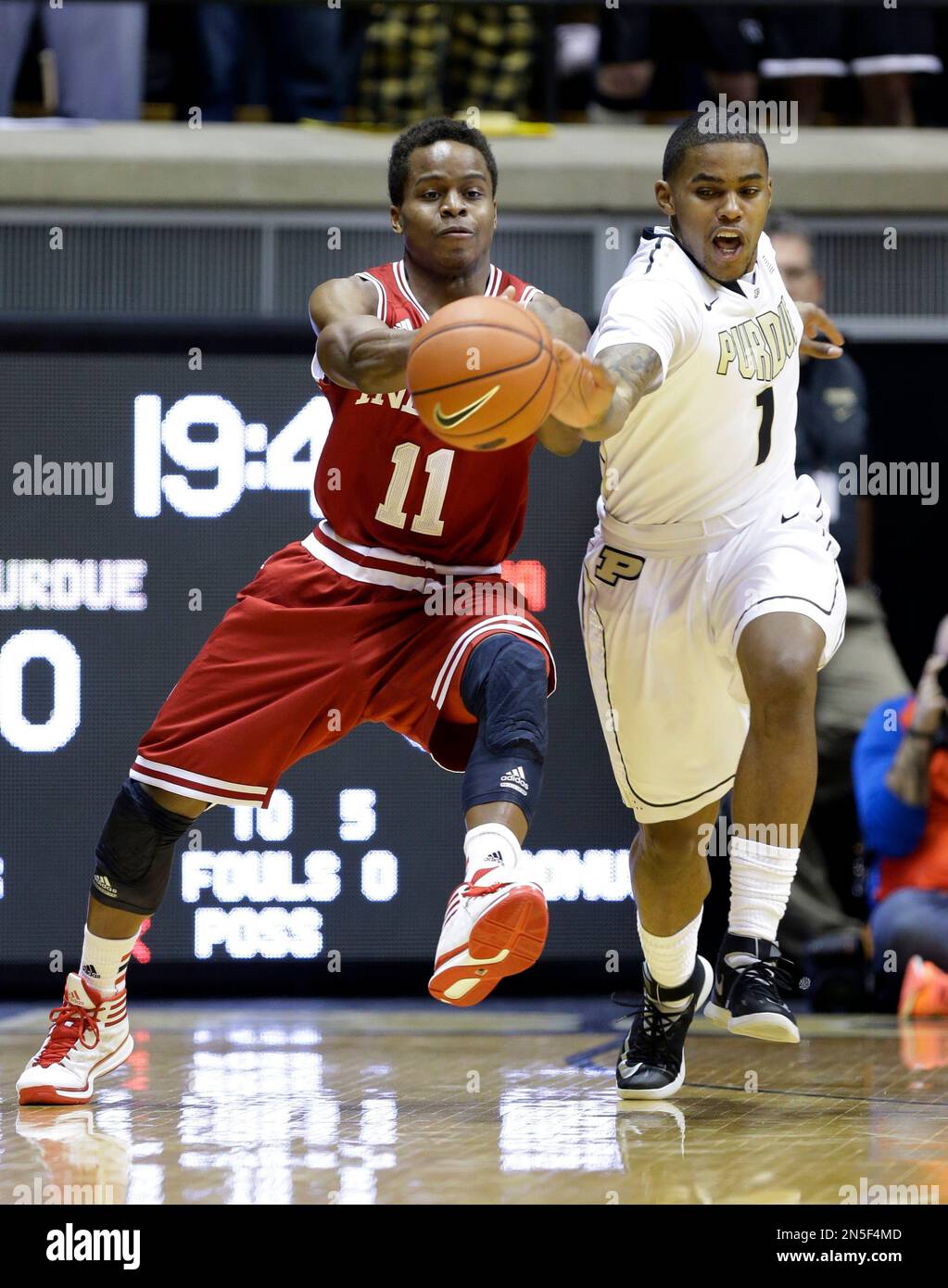 Purdue guard Sterling Carter, right, steals the ball from Indiana guard ...
