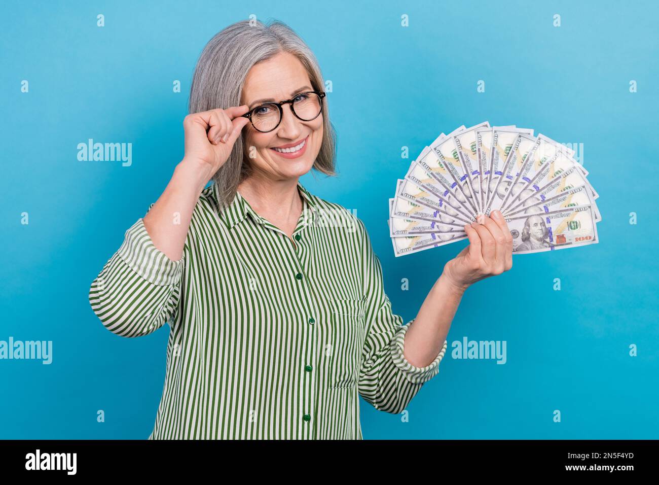 Photo of positive optimist cheerful business lady wear striped green ...