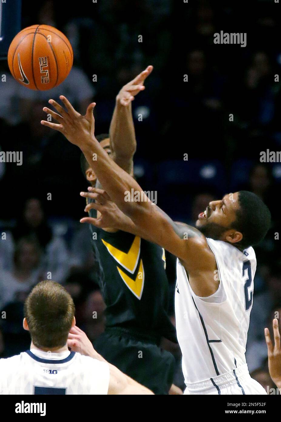 Penn State's D.J. Newbill, right, shoots around Iowa's Roy Devyn Marble ...
