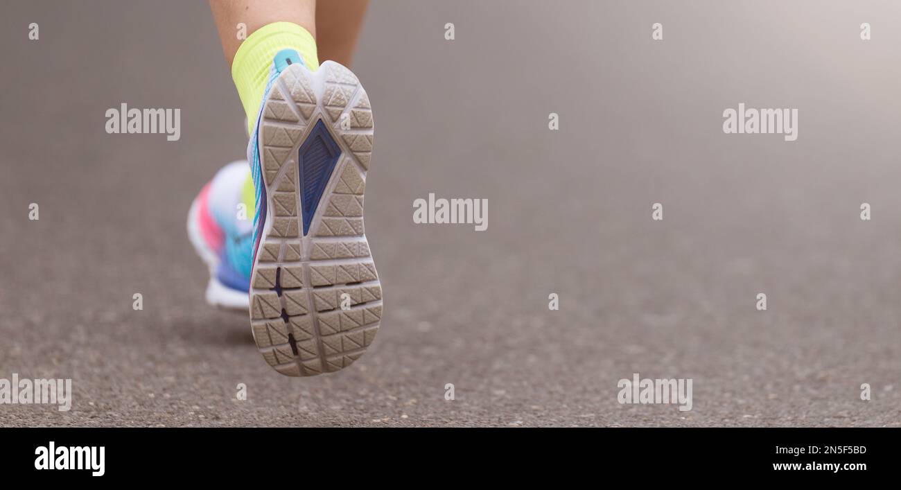 Athlete runner feet running on road close up on shoe , marathon running ...