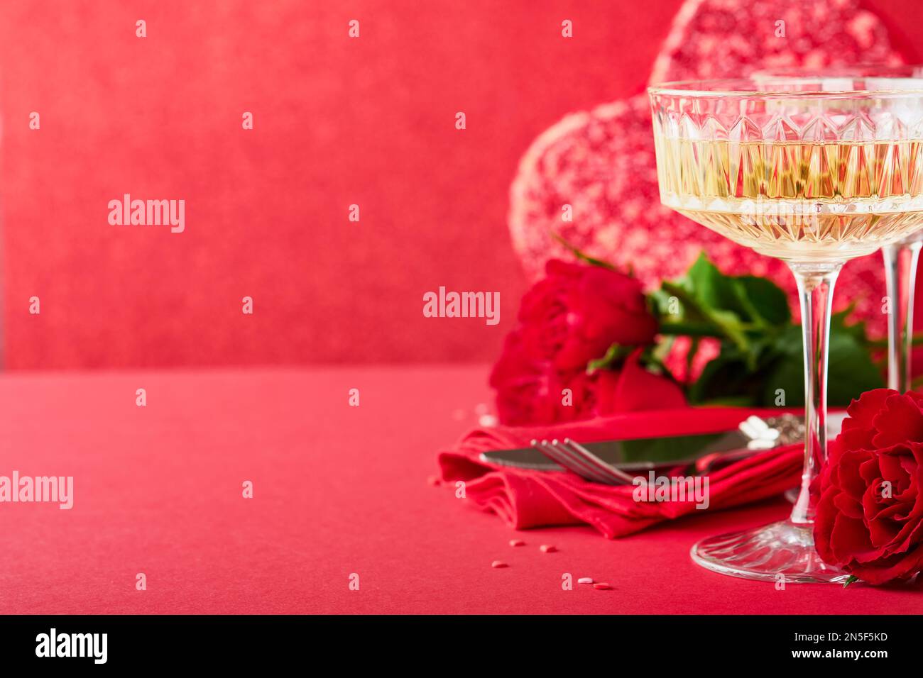 Valentines Day or Romantic dinner concept. Romantic table setting, silverware, wine glasses ...