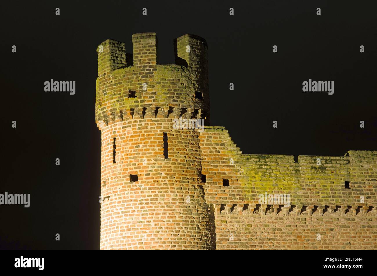 Medieval defence tower in the wall of the Berkelpoort at night in ...