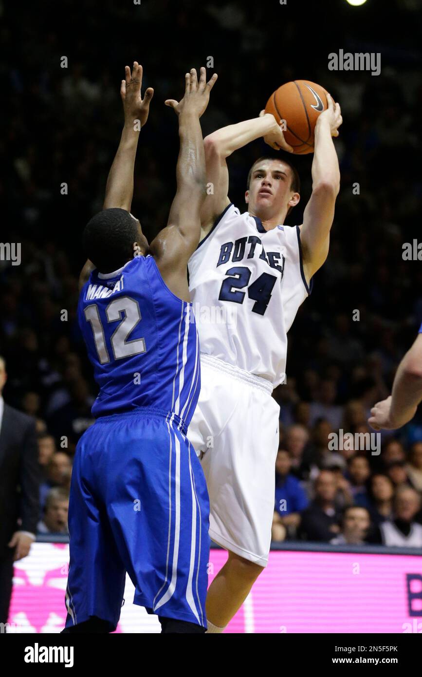 Butler guard Kellen Dunham, right, shoots over Creighton guard Jahenns ...