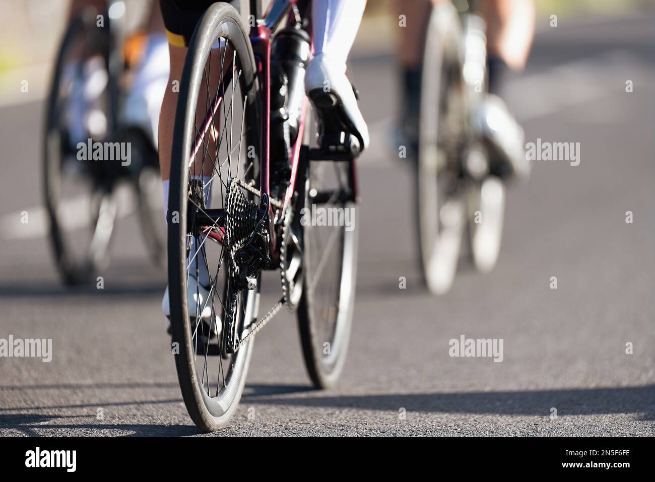 Group of cyclist at professional race, cyclists in a road race stage ...