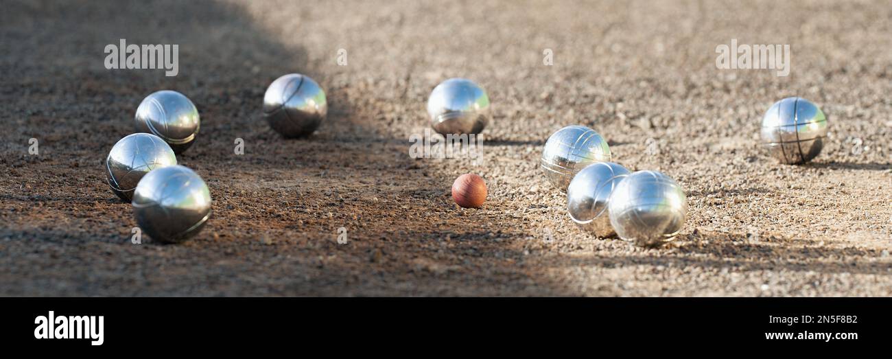 Petanque balls boules bowls on closeup on sand gravel court background ...