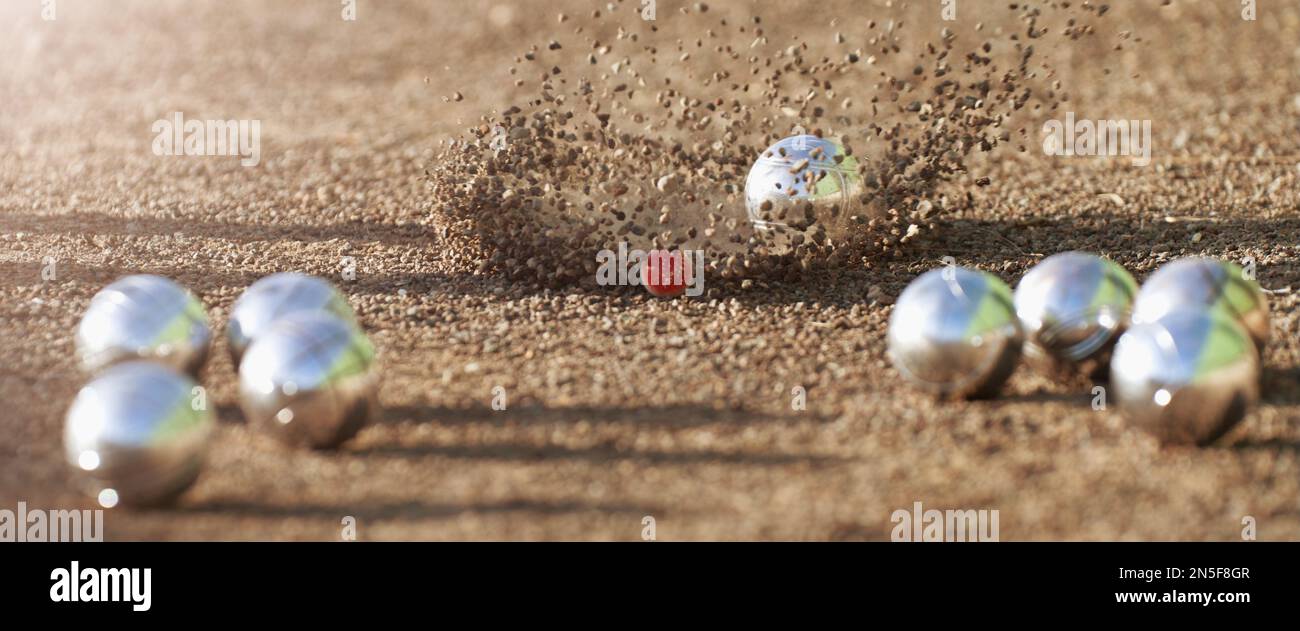 Petanque ball boules bowls on a dust floor, photo in impact. Game of ...