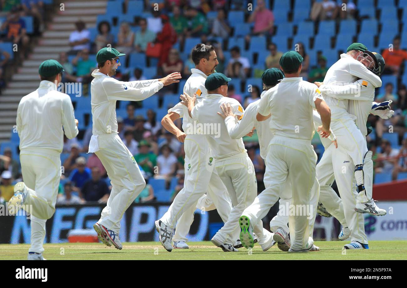 Australia's bowler Mitchell Johnson, center, celebrates with teammates ...