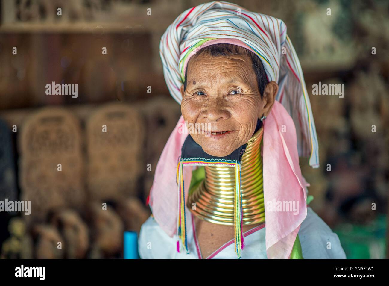 Portrait of a betel chewing long neck Kayan woman in Bagan, Myanmar ...