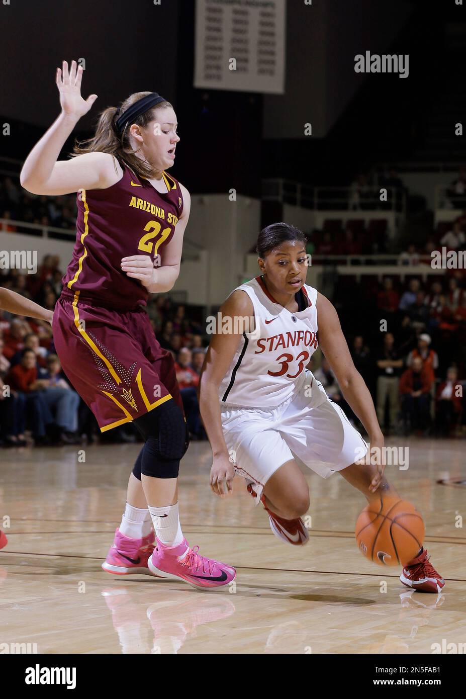 Stanford guard Amber Orrange (33) dribbles around Arizona State forward ...