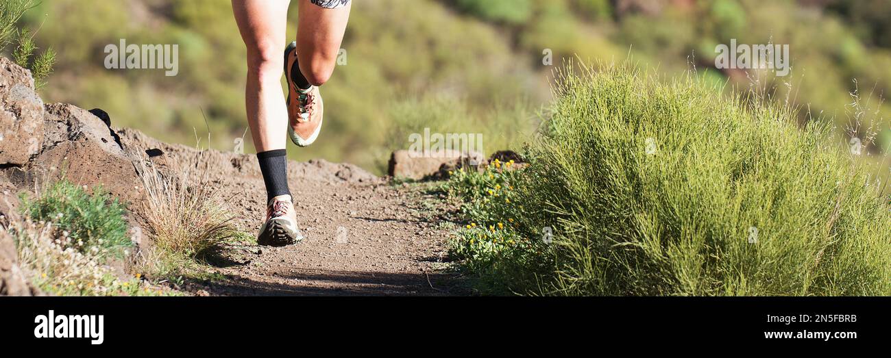 Trail running athlete exercising for fitness and health outdoors on ...