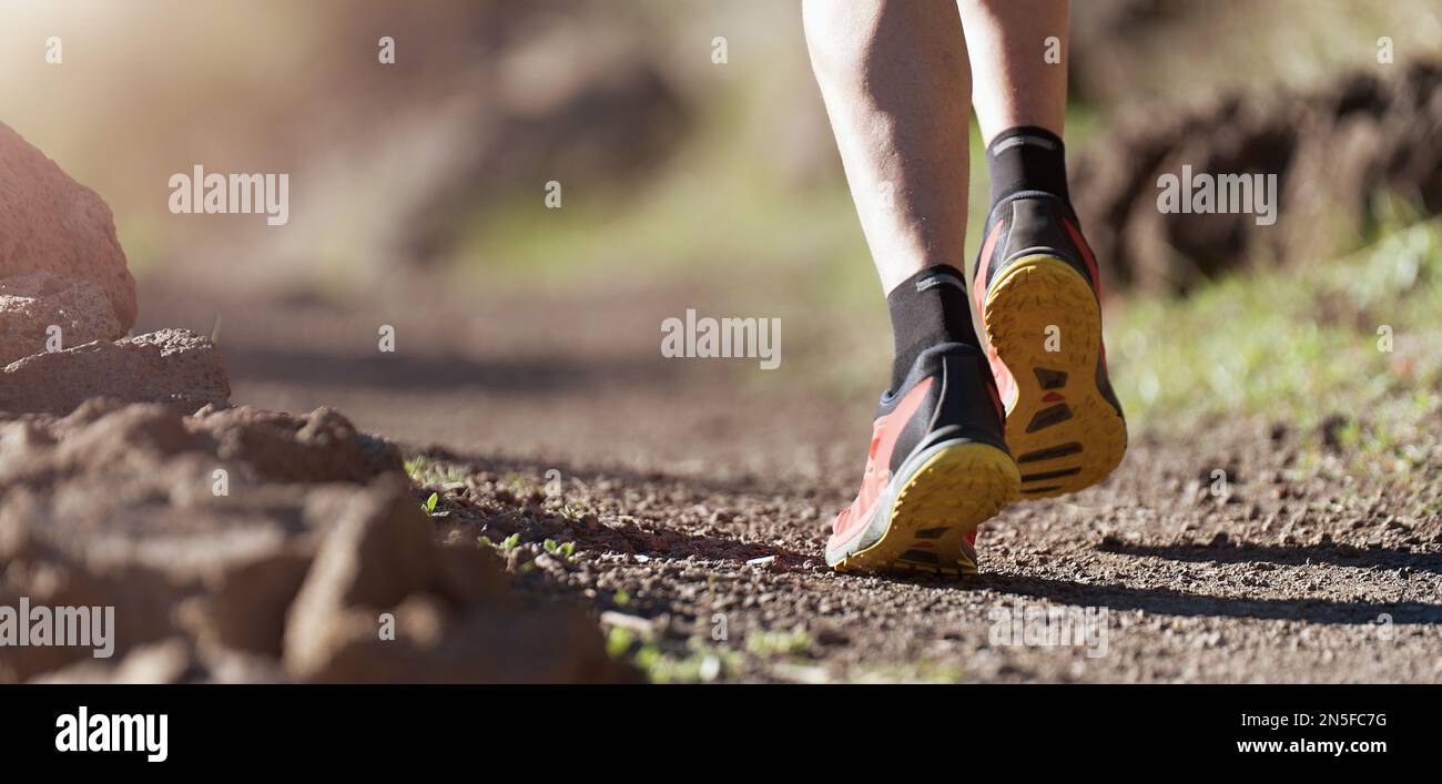 Trail running athlete exercising for fitness and health outdoors on ...