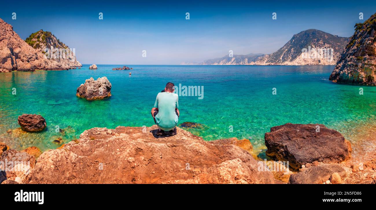Photographer take a picture of Agia Eleni beach. Bright morning ...