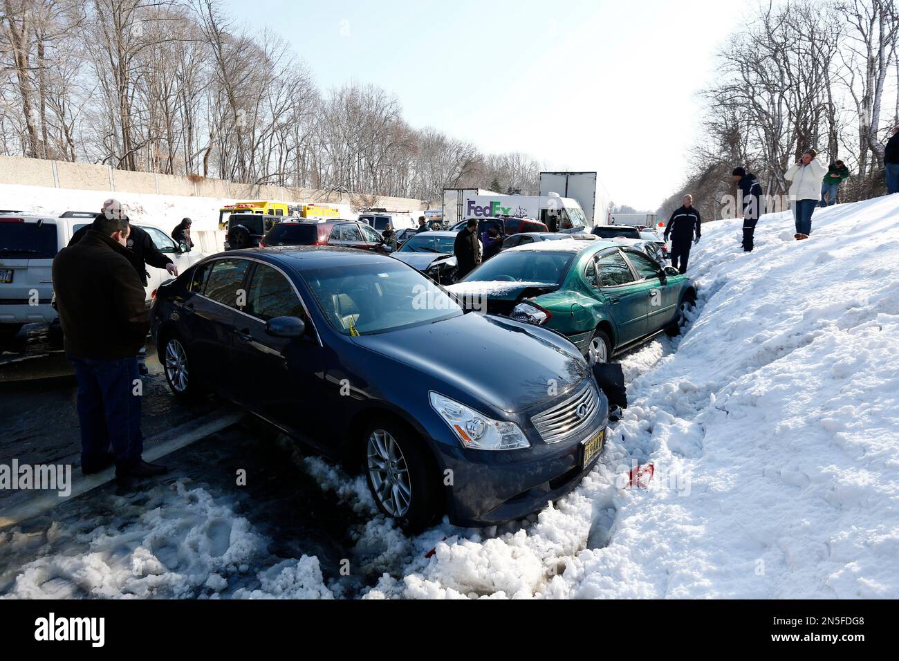 Vehicles are piled up in an accident, Friday, Feb. 14, 2014, in Bensalem, Pa. Traffic accidents ...