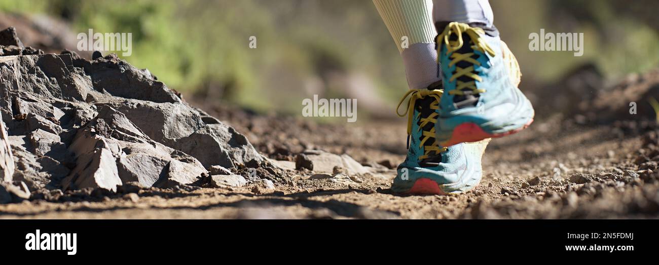 Trail running athlete exercising for fitness and health outdoors on ...