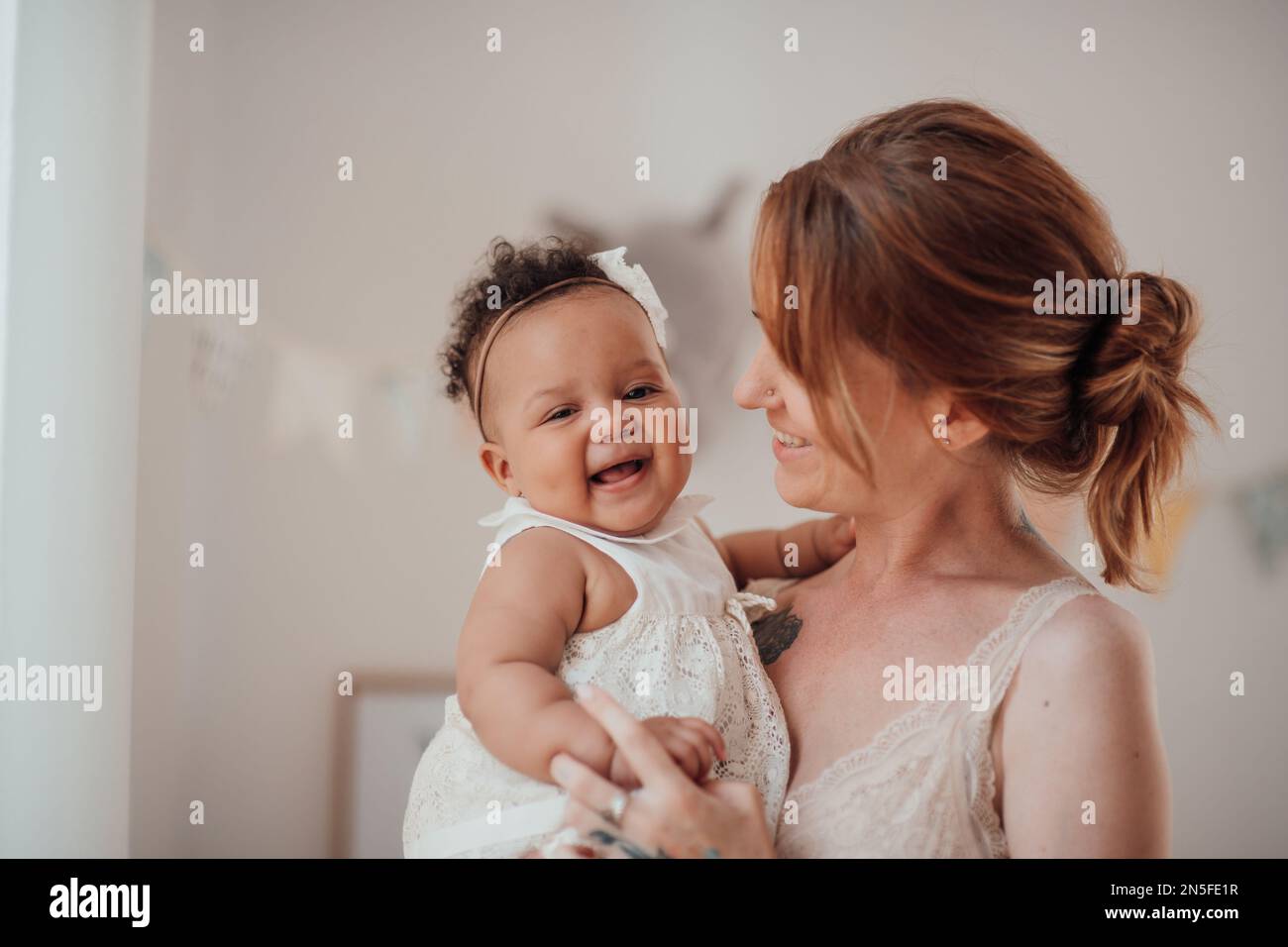 Diverse people portrait of mother with swarthy infant spending time in ...