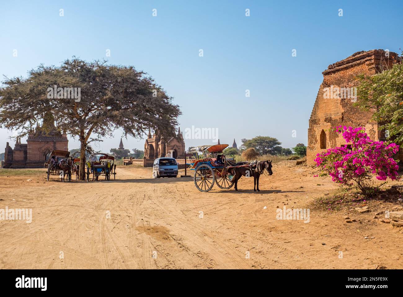 Tourists explore the archeological sites at Bagan on traditional two ...