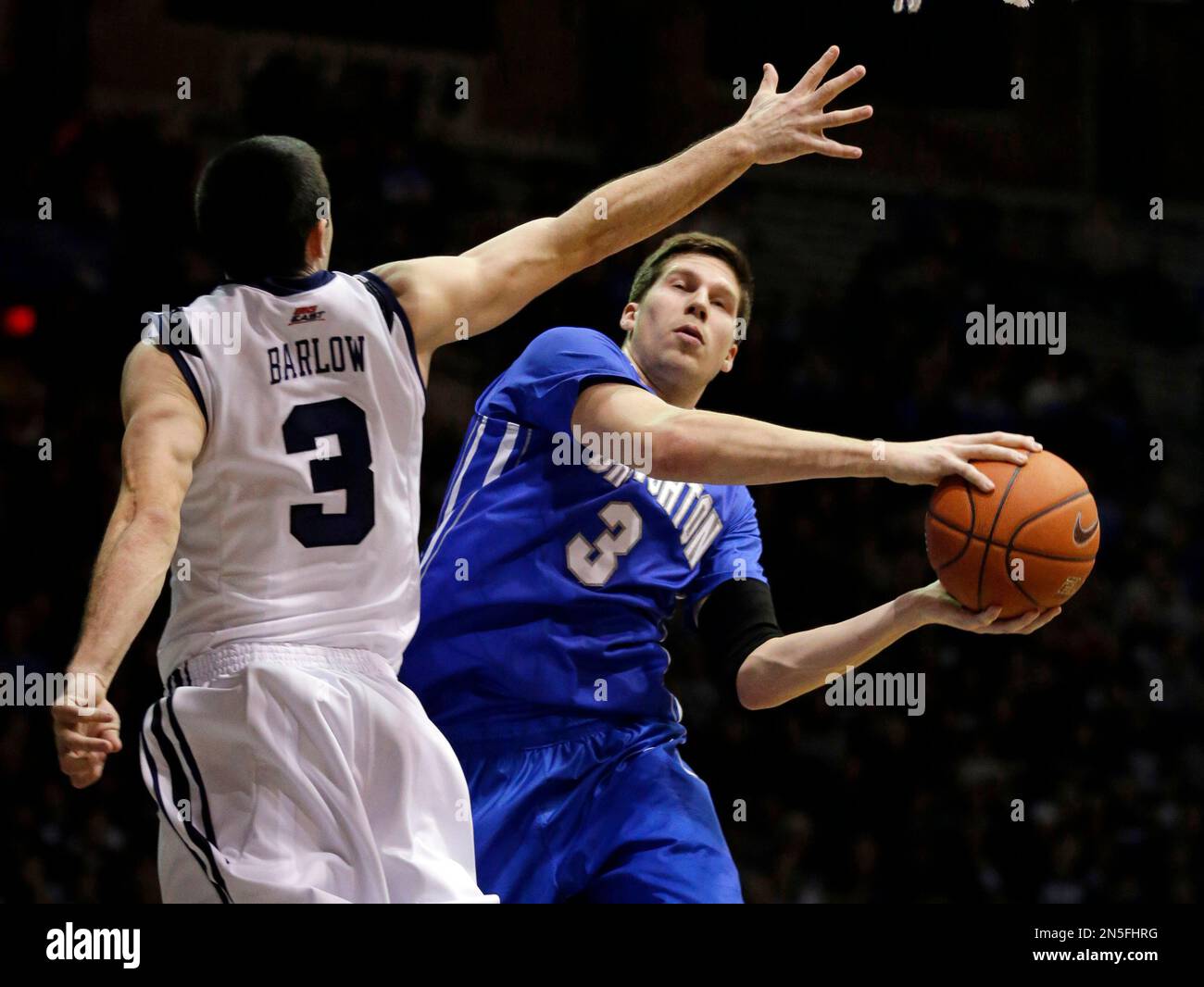 Creighton forward Doug McDermott, right, goes around Butler guard Alex ...
