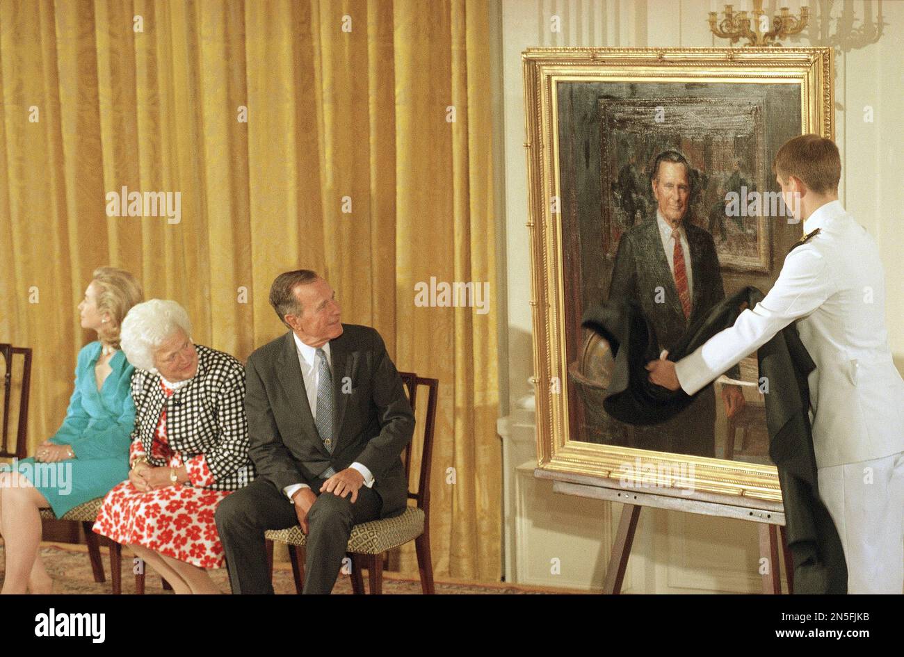 Former President George Bush and wife Barbara Bush look as his formal ...