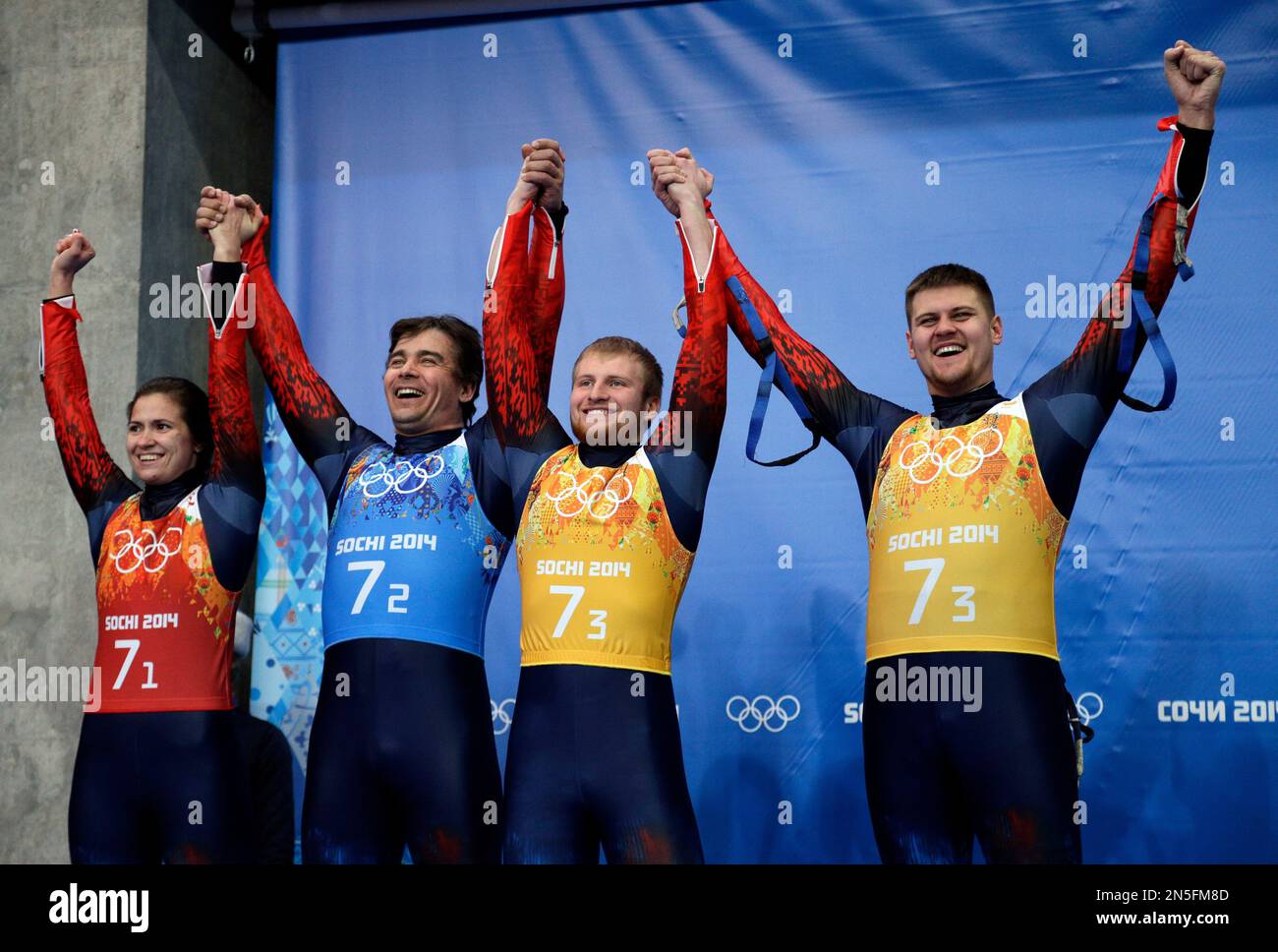 The Russian team of Tatyana Ivanova, in orange, Albert Demchenko, in ...