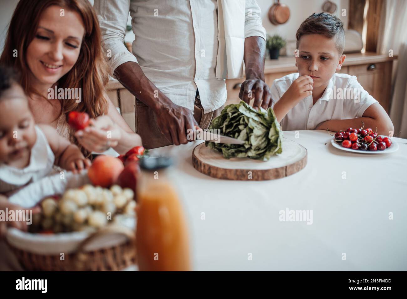 Mixed race family with white son infant swarthy daughter spend time ...