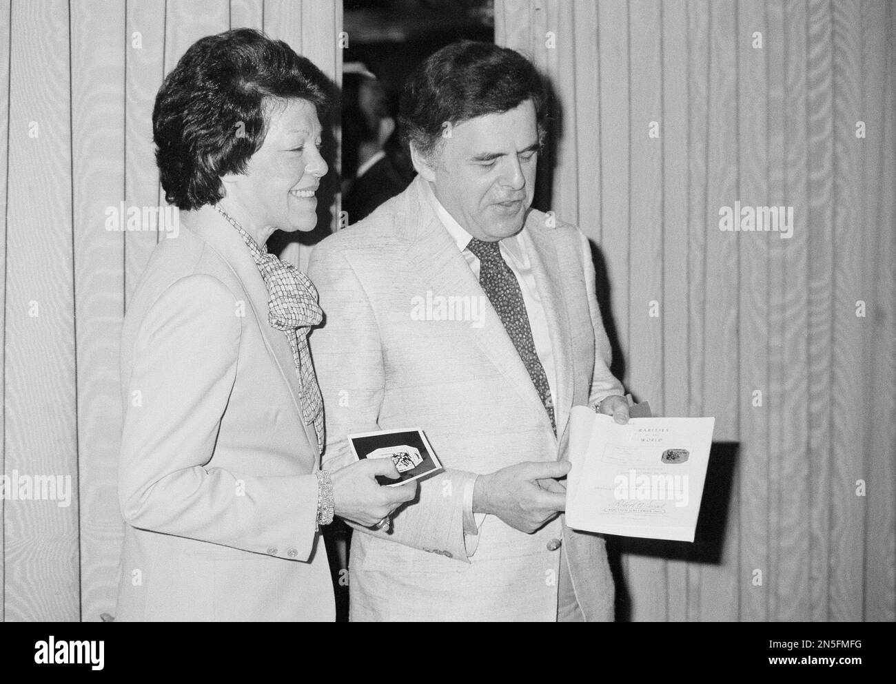 Rare stamp sellers Irwin Weinberg and his wife Jean are shown before ...