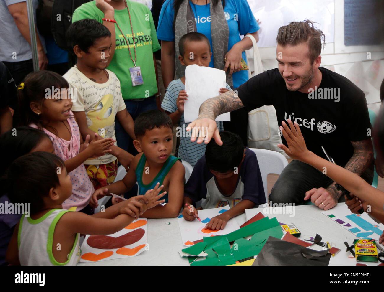 Former England soccer team captain David Beckham interacts with typhoon ...