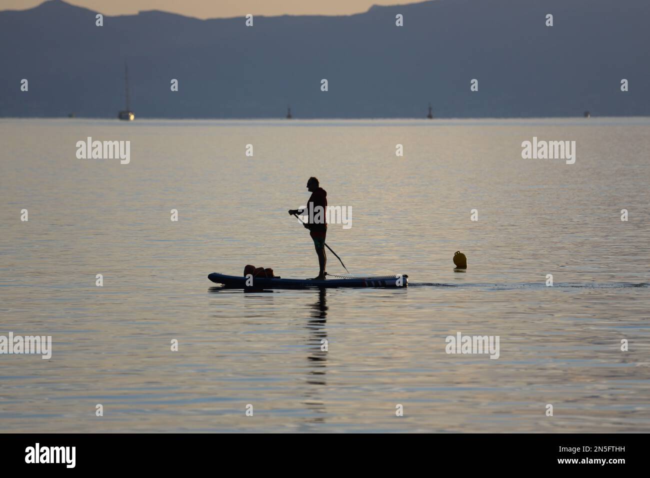 Bodrum, Mugla, Turkey. 15 January 2023 :man rowing to meditate on board ...