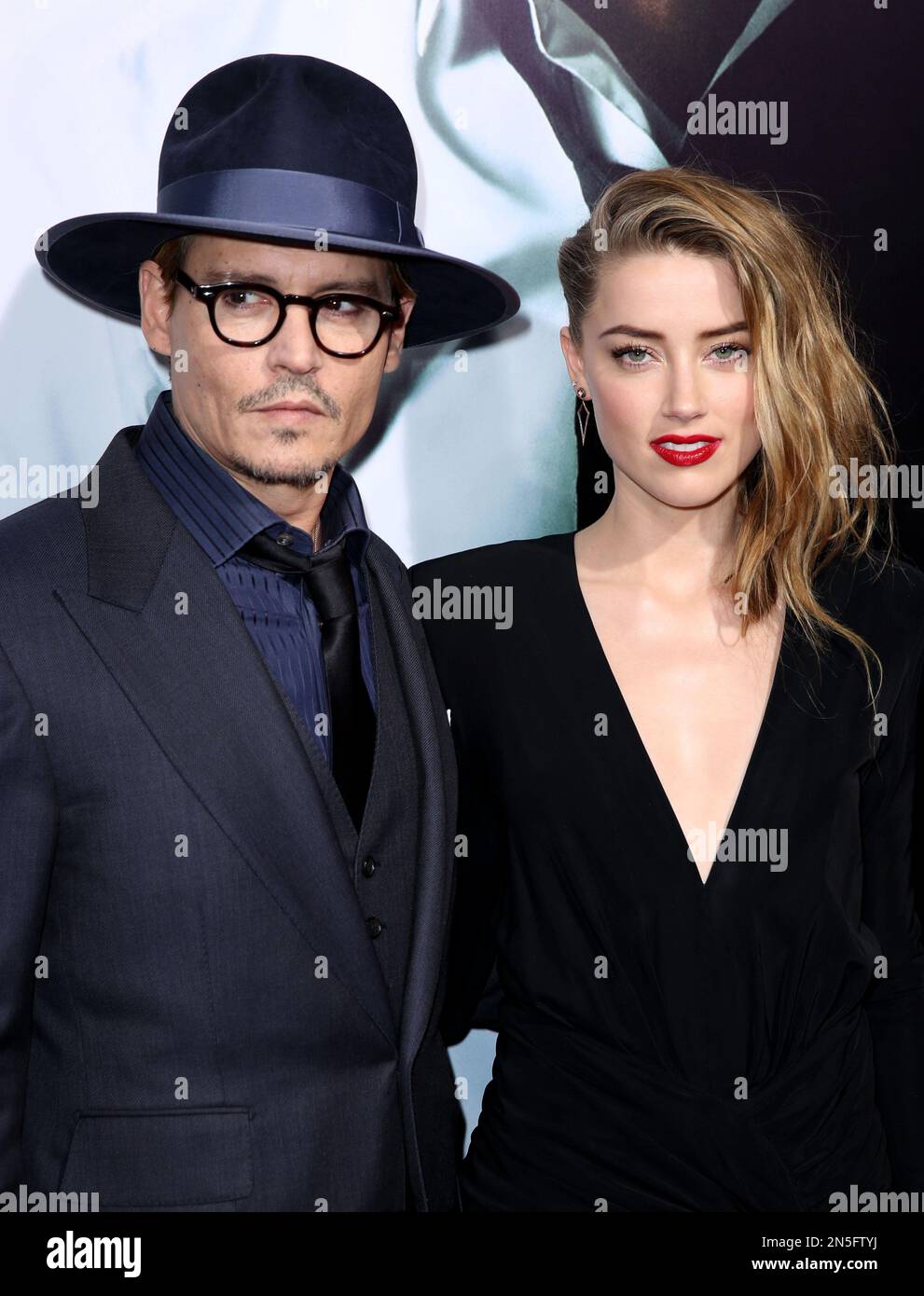 Johnny Depp, left, and Amber Heard arrive at the premiere of "3 Days to ...