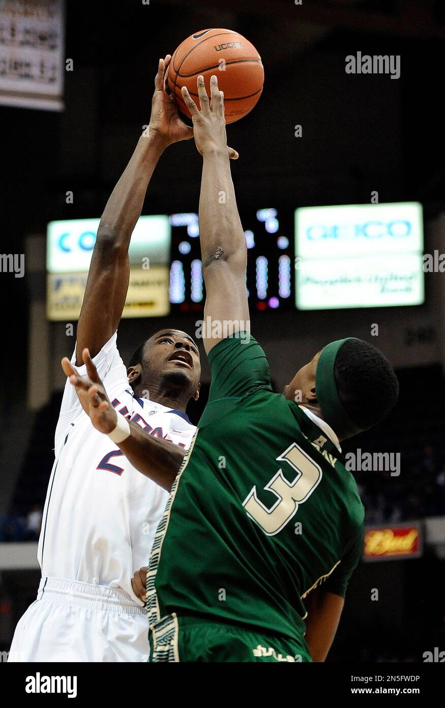 Connecticut's DeAndre Daniels shoots over South Florida's Zach LeDay ...