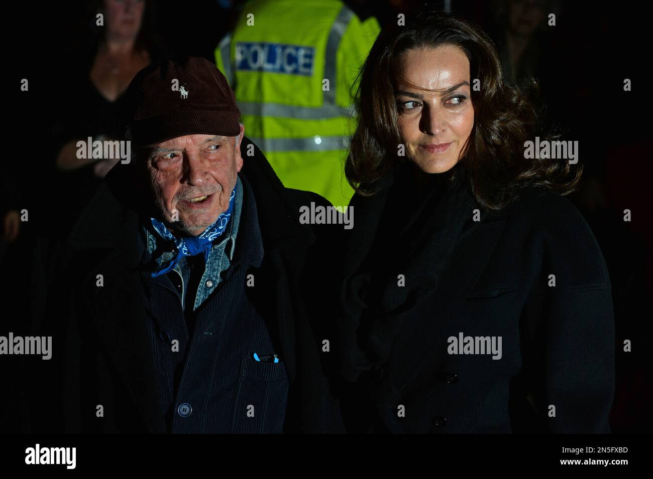 British photographer David Bailey, left, arrives with his wife, model ...