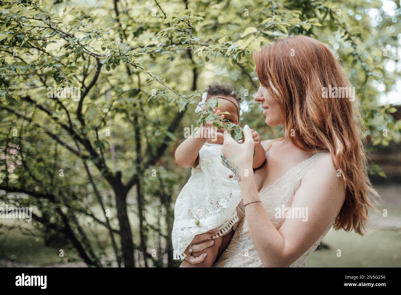 Diverse people portrait of mother with swarthy infant spending time in ...