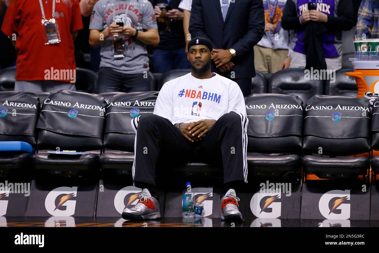 Miami Heat's LeBron James sits on the bench alone prior to an NBA ...