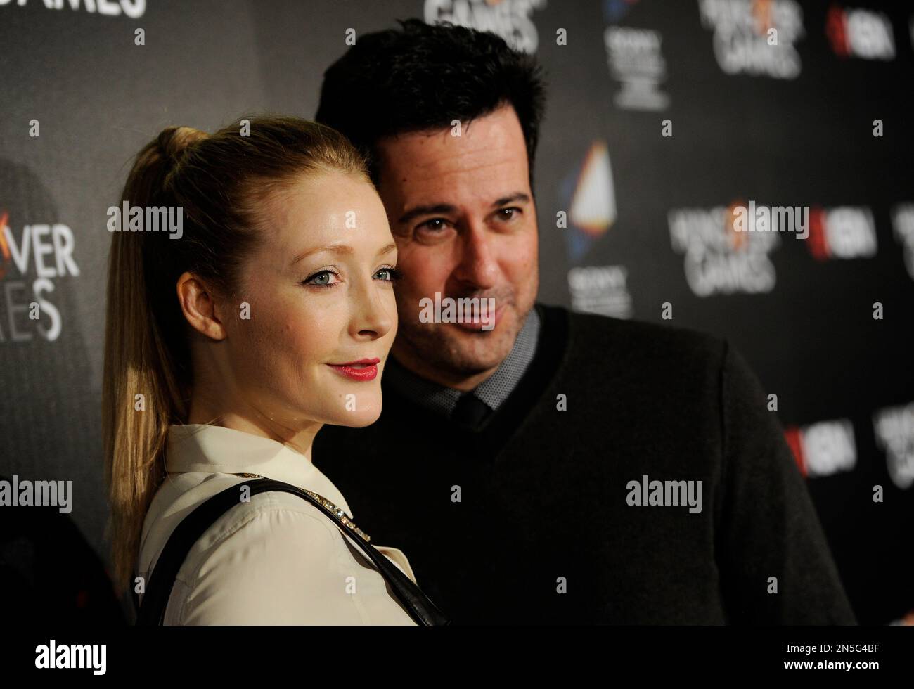 Actress Jennifer Finnigan poses with her husband Jonathan Silverman, a ...
