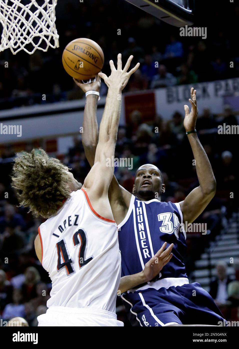 Oklahoma City Thunder forward Kevin Durant, right, shoots over Portland ...