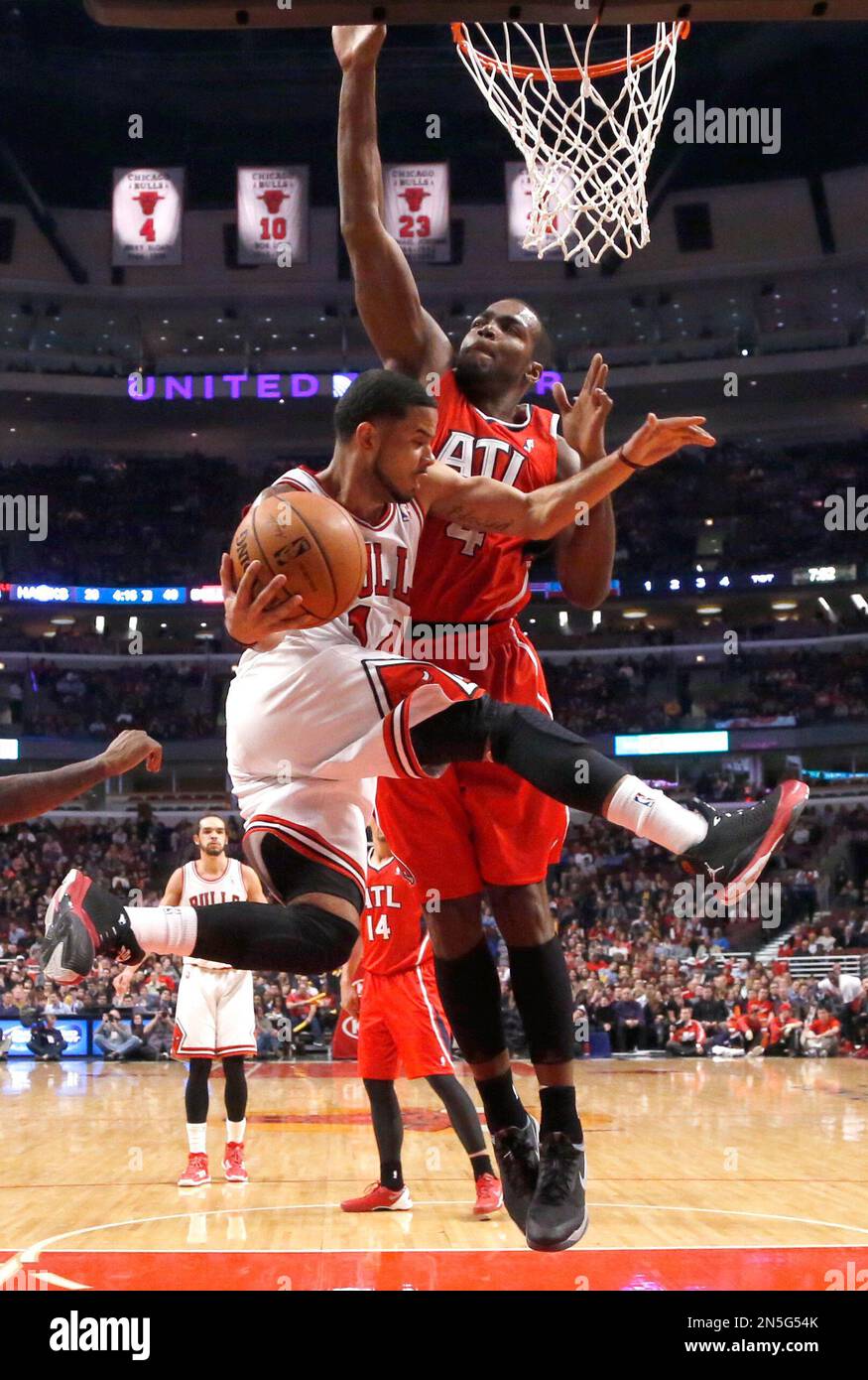 Chicago Bulls guard D.J. Augustin, left, drives past Atlanta Hawks ...
