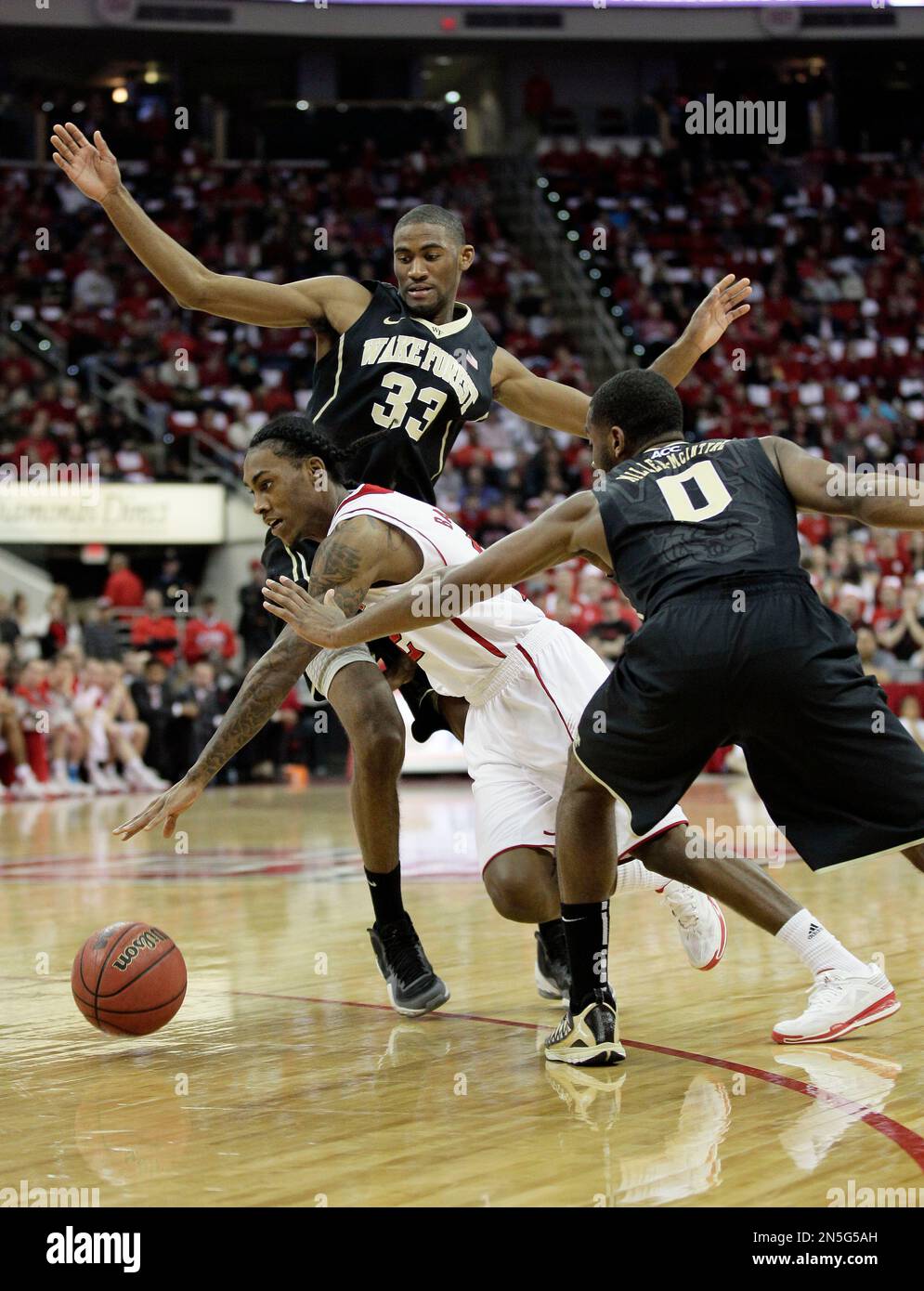 North Carolina State's Anthony Barber drives between Wake Forest's ...