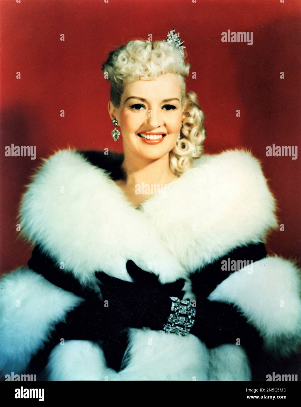 BETTY GRABLE Colour Portrait in white fur coat circa 1945 publicity for ...
