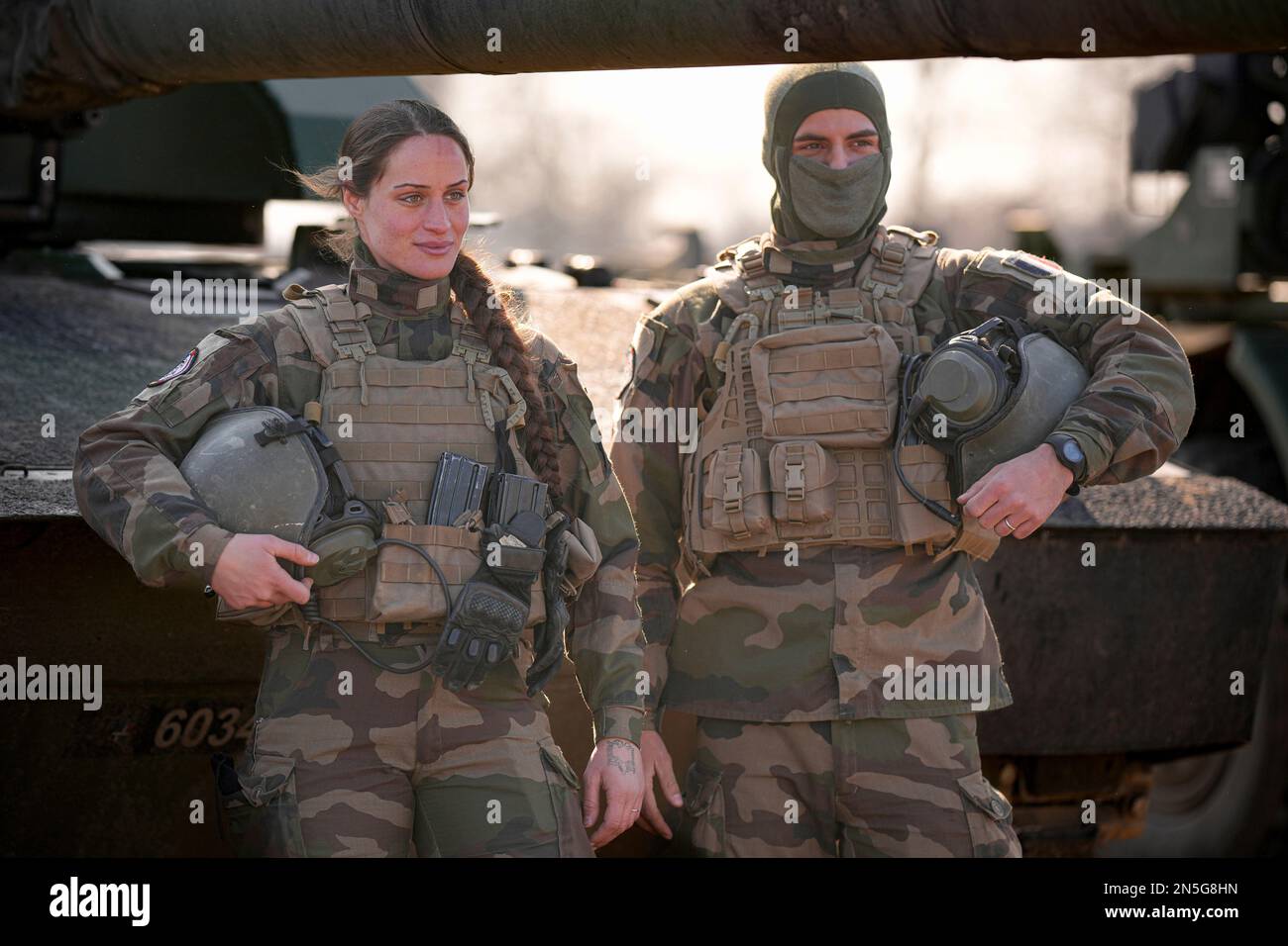 Crew members of a Leclerc main battle tank stand during a joint French ...