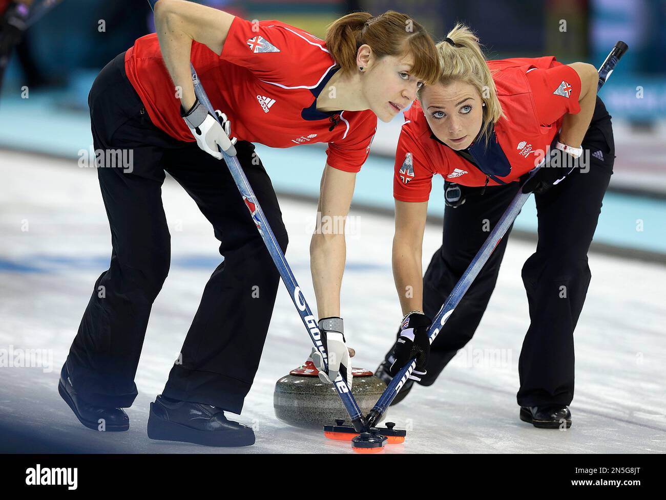 Anna Sloan, right, and Claire Hamilton, left, sweep the ice during the ...