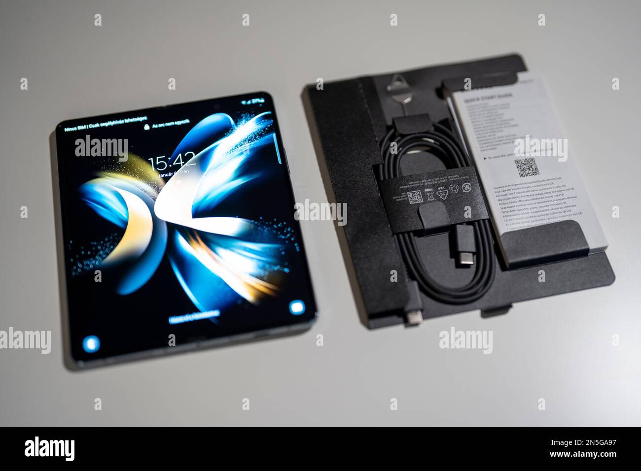 Brand new Samsung Galaxy Z Fold 4 in grey-green color. The device is in ...